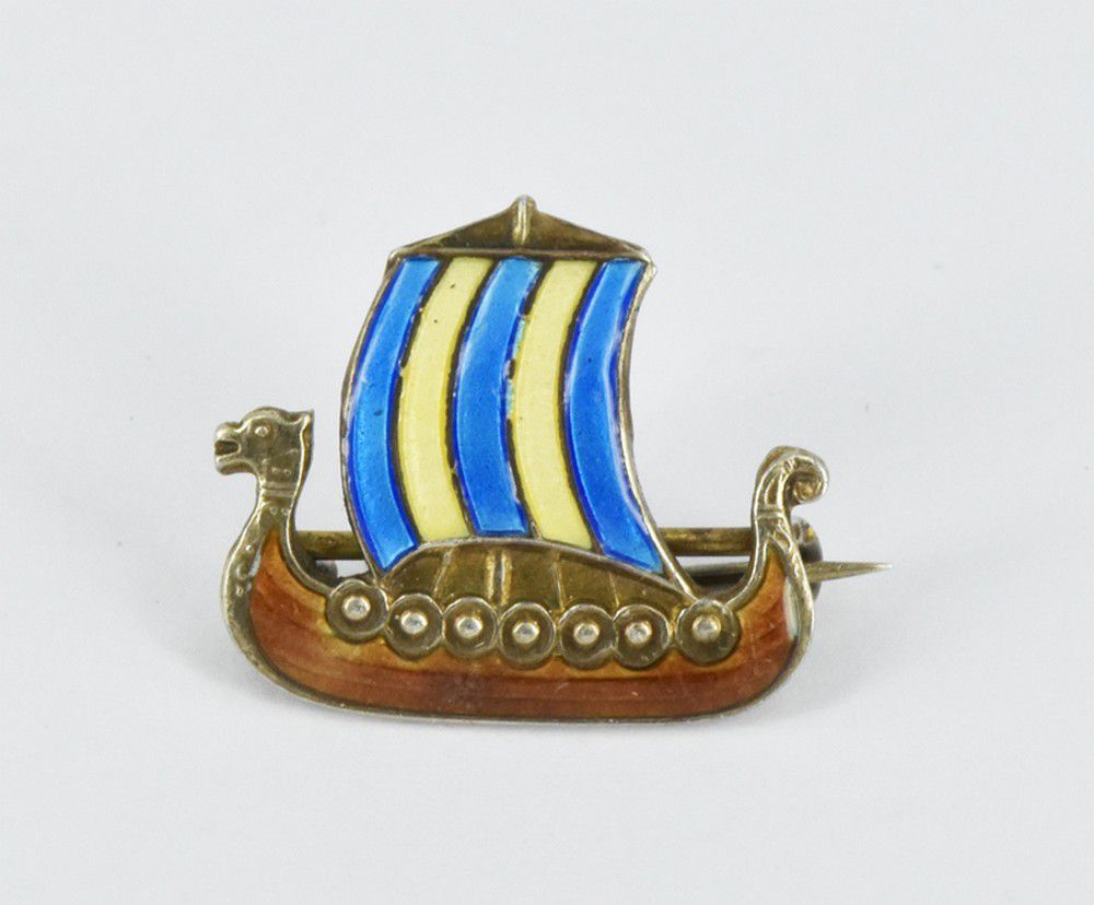 A Viking ship shaped brooch, enamel on sterling silver. Made in ...