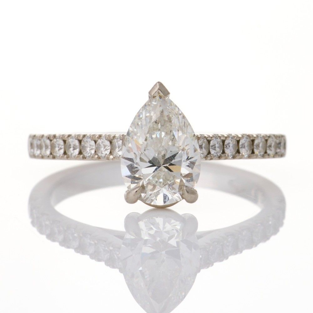 Platinum Pear Cut Diamond Solitaire Ring with Side Diamonds - Rings ...