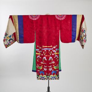 A small robe, south Korea, mid 20th century. A deep red fabric ...