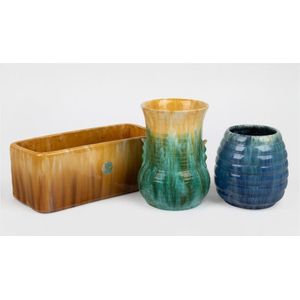John Campbell brown and yellow glazed pottery trough; together ...