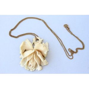 Vinatge carved ivory pendants and lockets - price guide and values