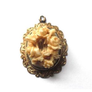 Vinatge carved ivory pendants and lockets - price guide and values