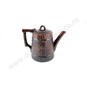 A rare Milton ten cup teapot, brown majolica type glaze. Moulds ...