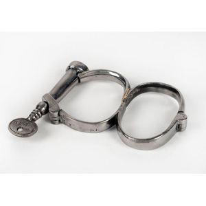 Figure 8 nickel plated handcuffs with key, 20th century, 13.5 ...