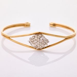 Yellow and white gold bangle with diamond cluster swirl design ...