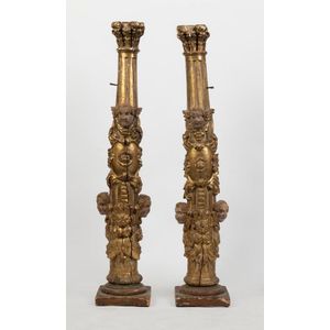 Gilded figural columns with Corinthian capitals and winged cupids ...