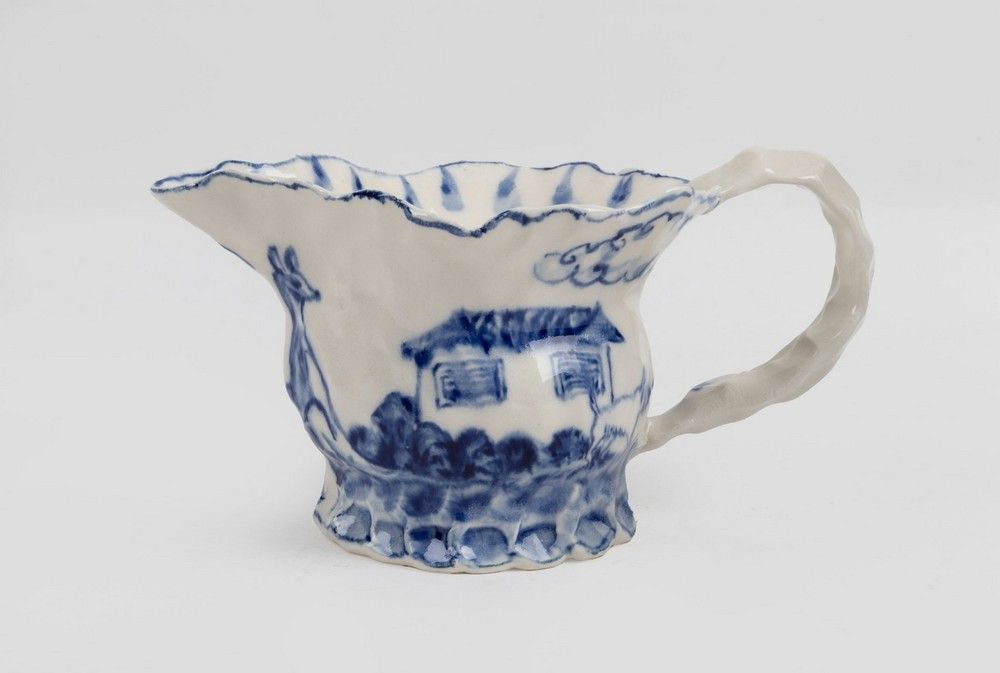 Blue and white hand-painted pottery jug with kangaroo and dog ...