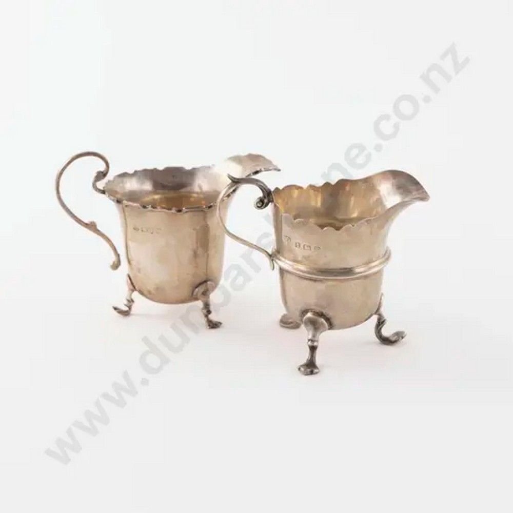 Sterling silver cream jugs with waved rims and scroll handle - Jugs ...