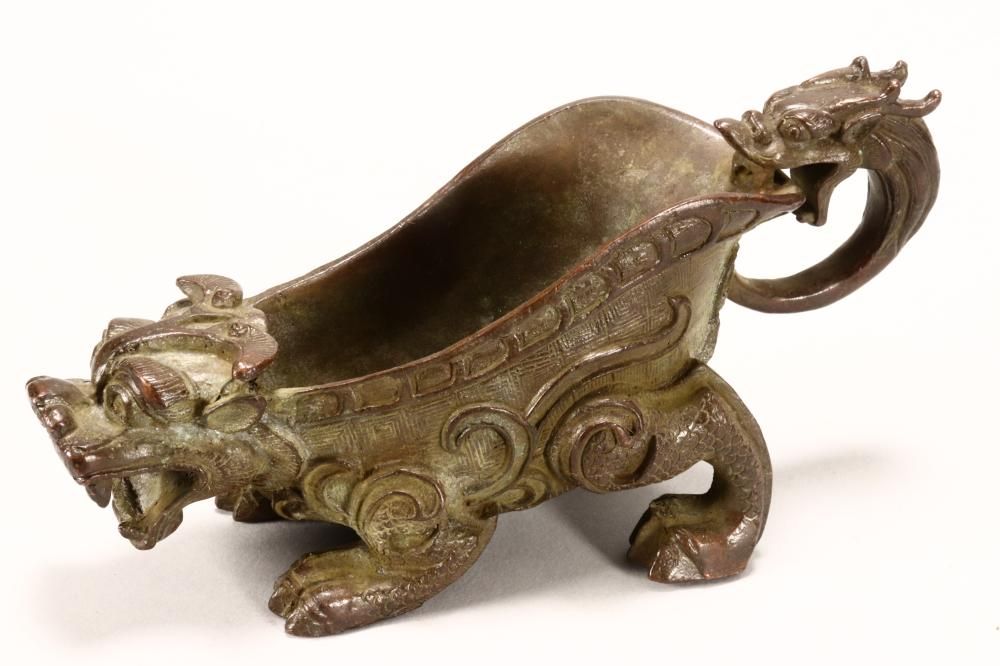 Chinese bronze libation cup with dragon handle, mythical creature form ...